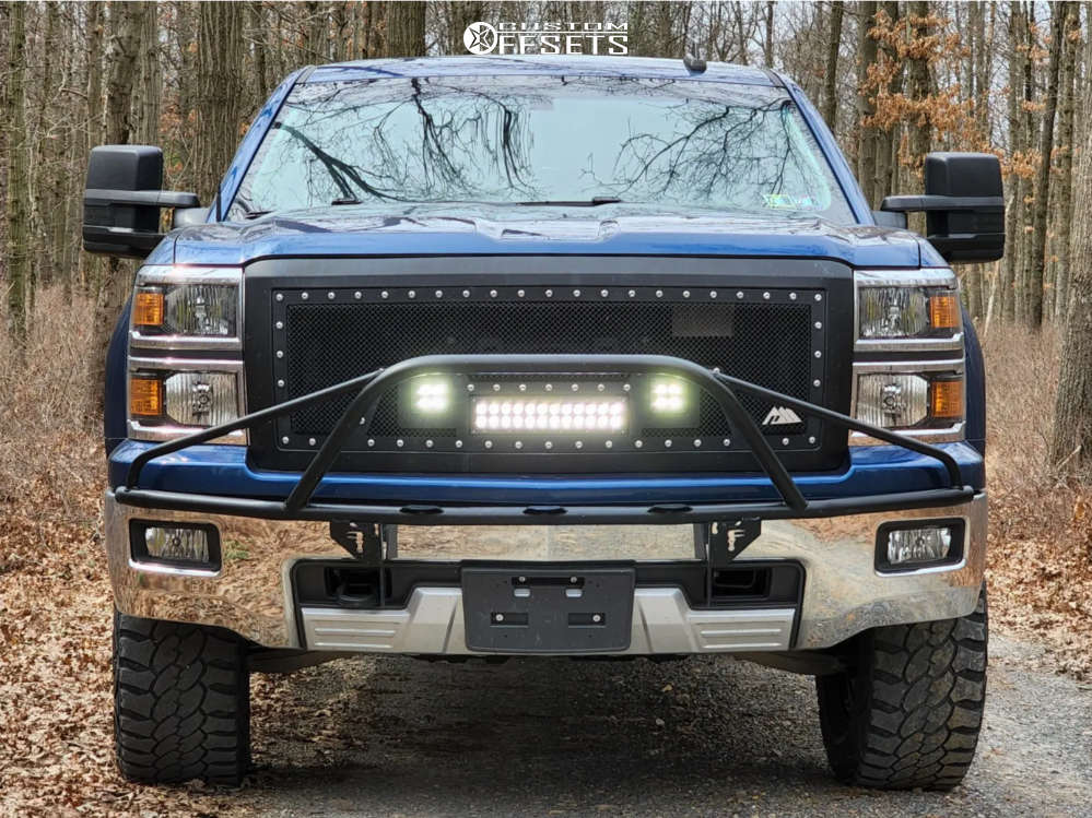 2015 Chevrolet Silverado 1500 with 18x9 18 XD Monster and 295/65R18 Pro Comp Xtreme Mt2 and ...