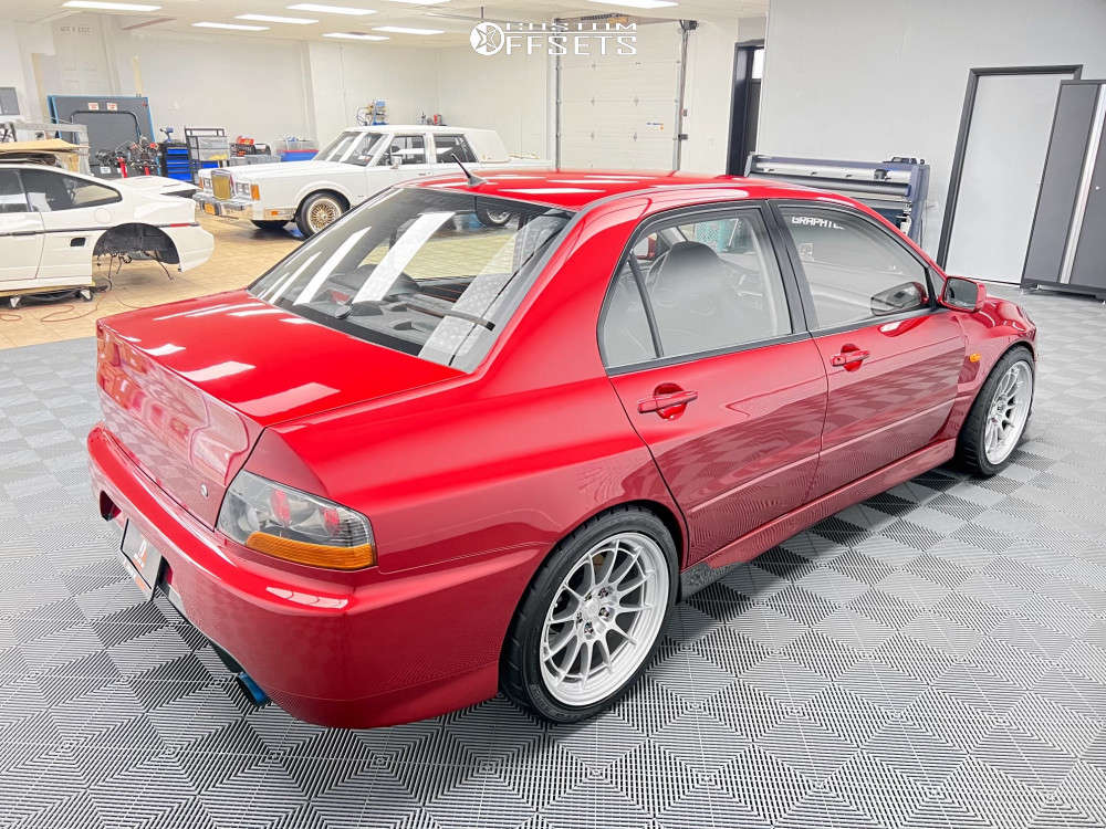 2003 Mitsubishi Lancer with 18x9.5 27 Enkei Nt03m and 265/35R18 Nitto ...
