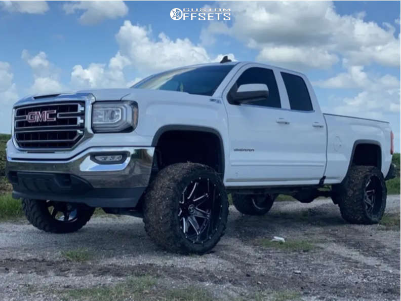 2017 GMC Sierra 1500 with 22x12 -44 Hostile Alpha and 33/14.5R22 AMP Mud Terrain Attack Mt A and ...