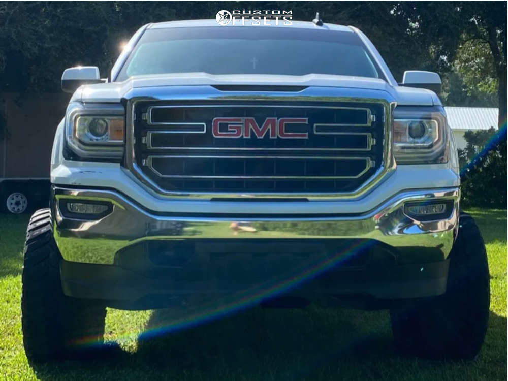 2017 GMC Sierra 1500 with 22x12 -44 Hostile Alpha and 33/14.5R22 AMP Mud Terrain Attack Mt A and ...