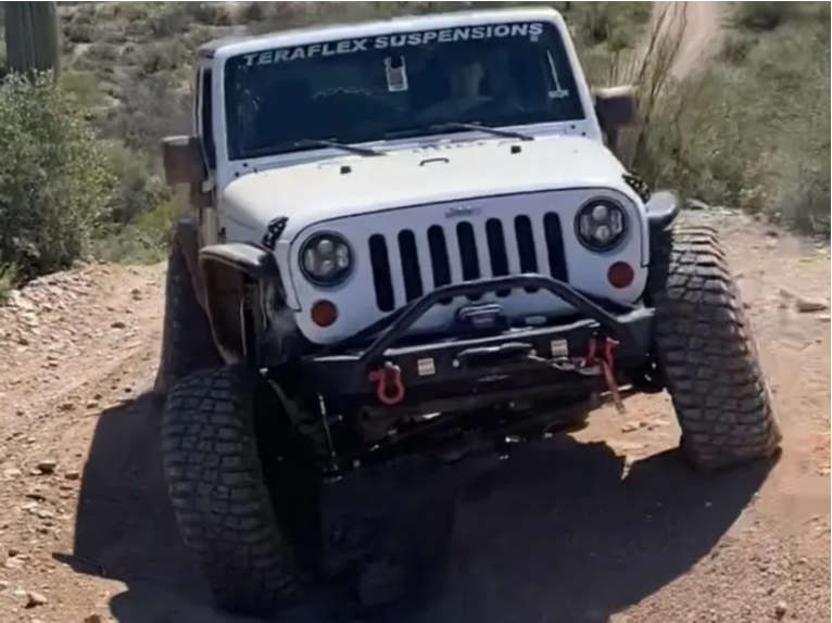 2012 Jeep Wrangler with 17x8.5 KMC Km235 and 37/12.5R17 BFGoodrich Mud ...