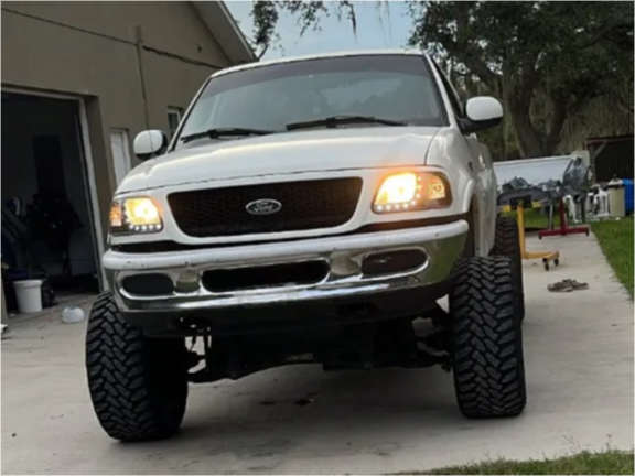 1999 Ford F-150 with 20x12 -57 Vision Spyder and 35/13.5R20 Venom Power ...