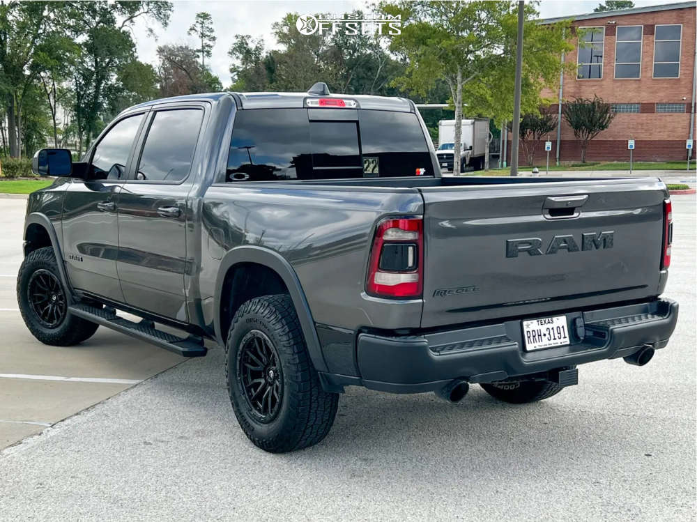 2020 Ram 1500 with 18x9 -12 Fuel Rebel and 275/65R18 Cooper Discoverer ...