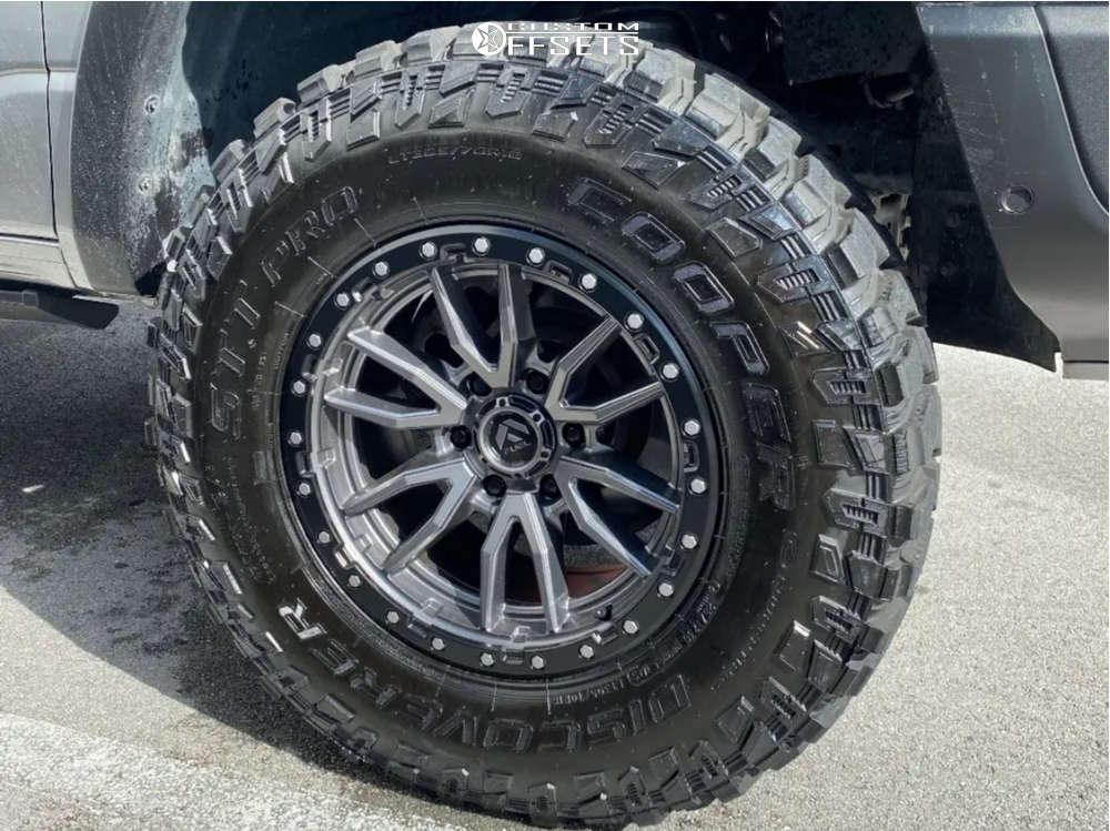 2021 Ram 1500 with 18x9 1 Fuel Rebel and 305/70R18 Cooper Discoverer ...