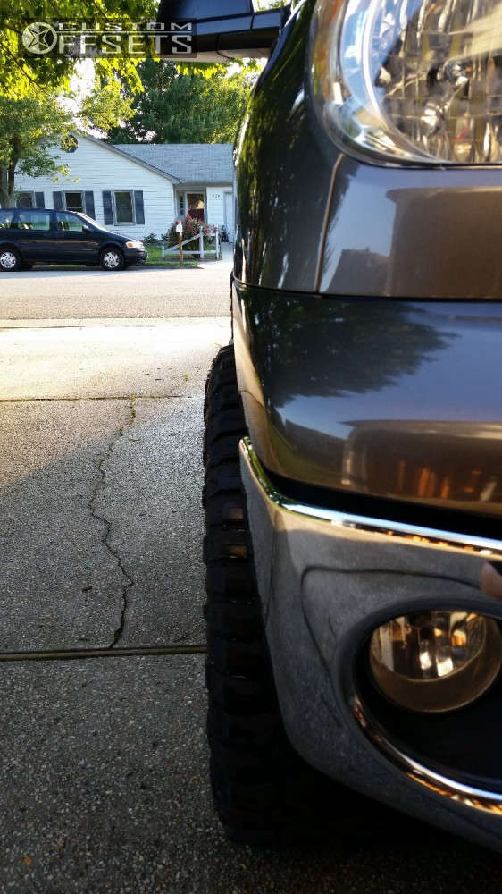 2010 Toyota Tundra with 18x9 12 Level 8 Tracker and 33/12.5R18 Nitto ...
