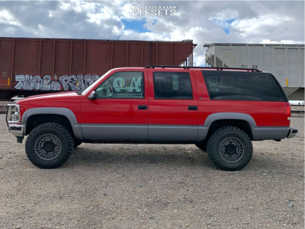 1999 Chevrolet K1500 Suburban with 17x9.5 -18 Black Rhino Armory and 33 ...