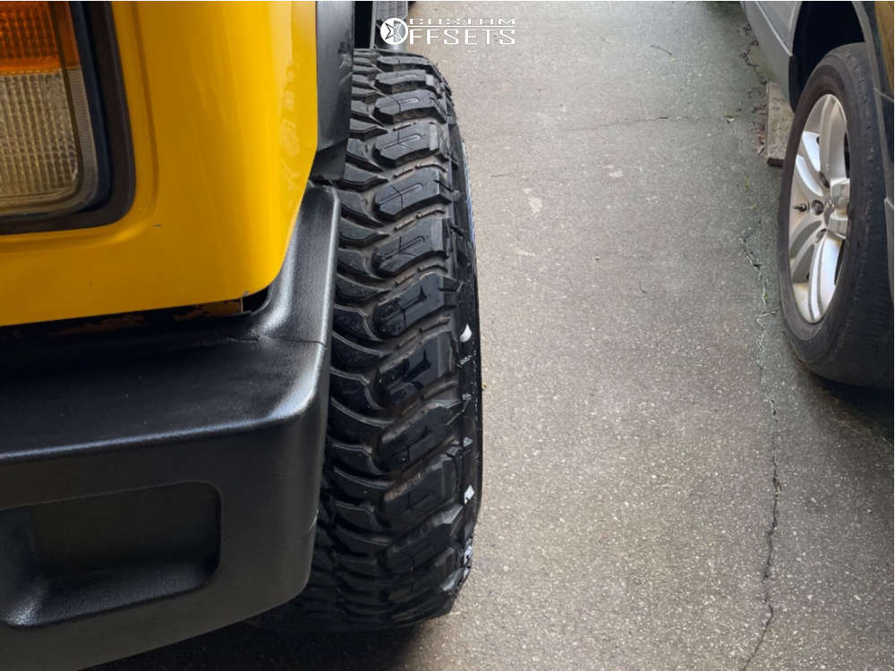 2003 Hummer H2 with 22x14 -76 Moto Metal Mo962 and 35/13.5R22 Atturo ...