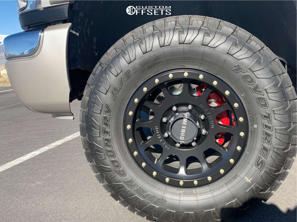 2005 GMC Sierra 2500 HD with 17x8.5 0 Method 305 Nv and 285/75R17 Toyo ...