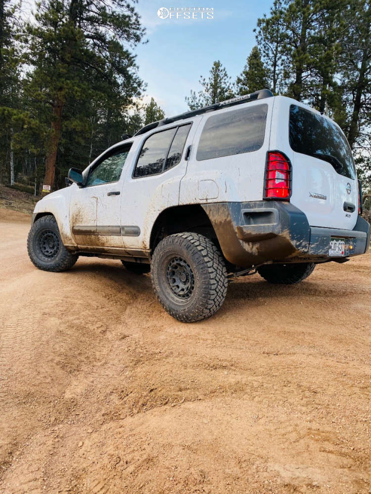 2006 Nissan Xterra with 16x8 0 Black Rhino Chamber and 265/75R16 ...
