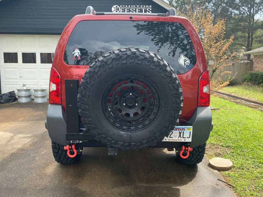 2013 Nissan Xterra with 16x8 0 Black Rhino Chamber and 285/75R16 Cooper ...