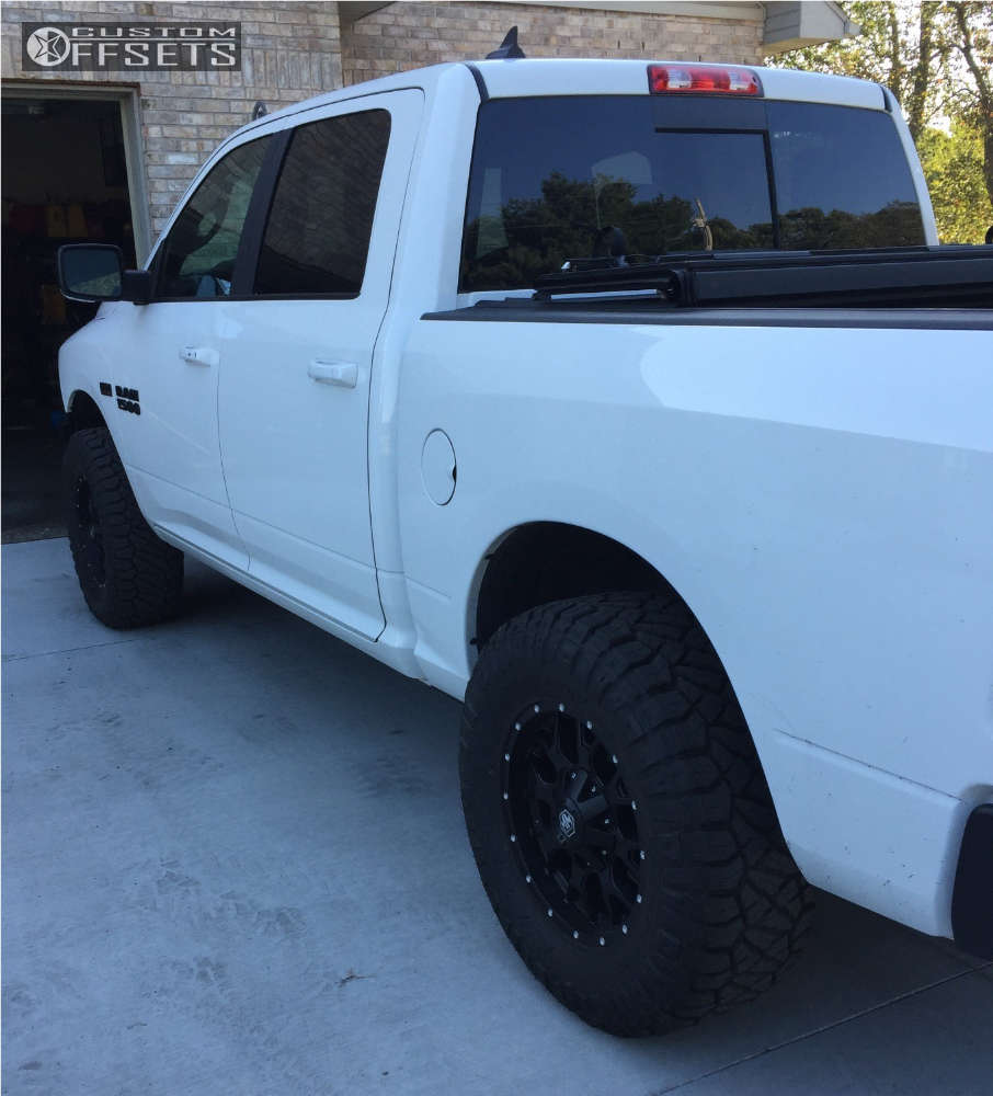 2017 Ram 1500 with 18x9 -12 Mayhem Warrior and 35/12.5R18 Nitto Ridge ...