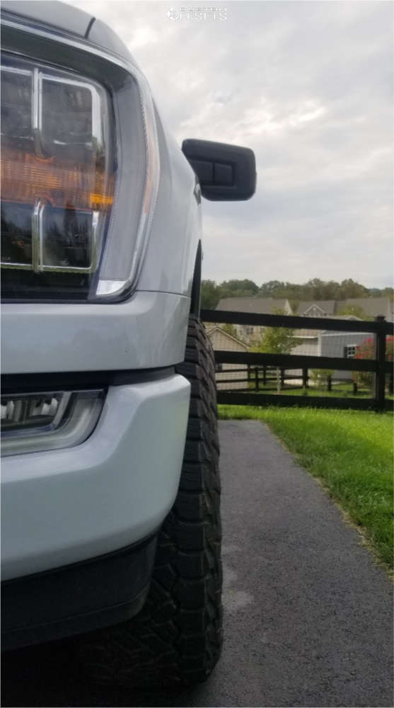 2022 Ford F-150 with 18x9 18 Rotiform STL and 295/70R18 Nitto Recon ...