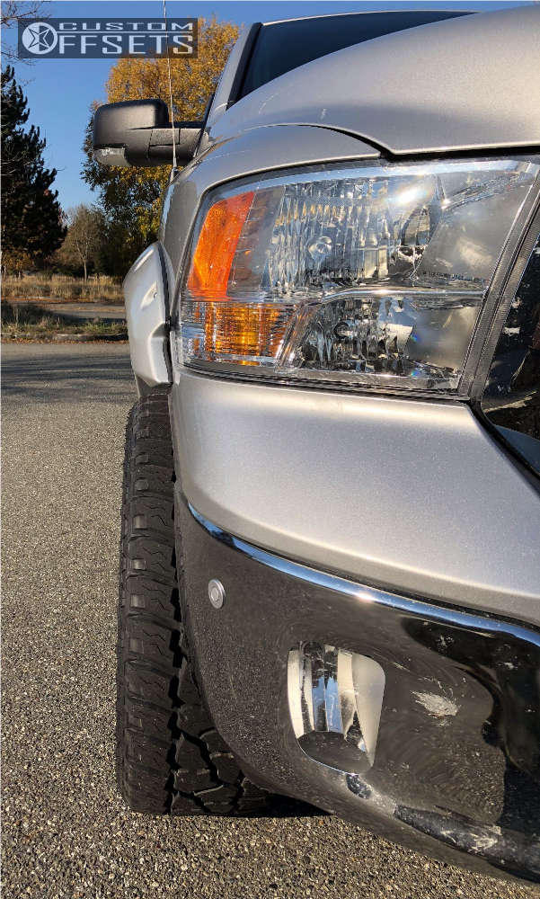 2016 Ram 1500 with 20x10 -24 Helo HE900 and 35/12.5R20 Mickey Thompson ...