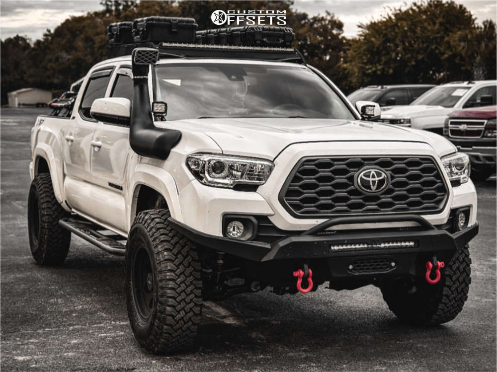2019 Toyota Tacoma with 16x8 -12 Pro Comp 69 and 255/85R16 Falken ...