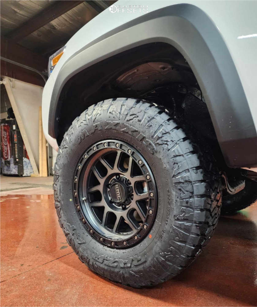2023 Toyota Tacoma with 17x8.5 0 KMC Km544 and 285/70R17 Maxxis Razr AT ...