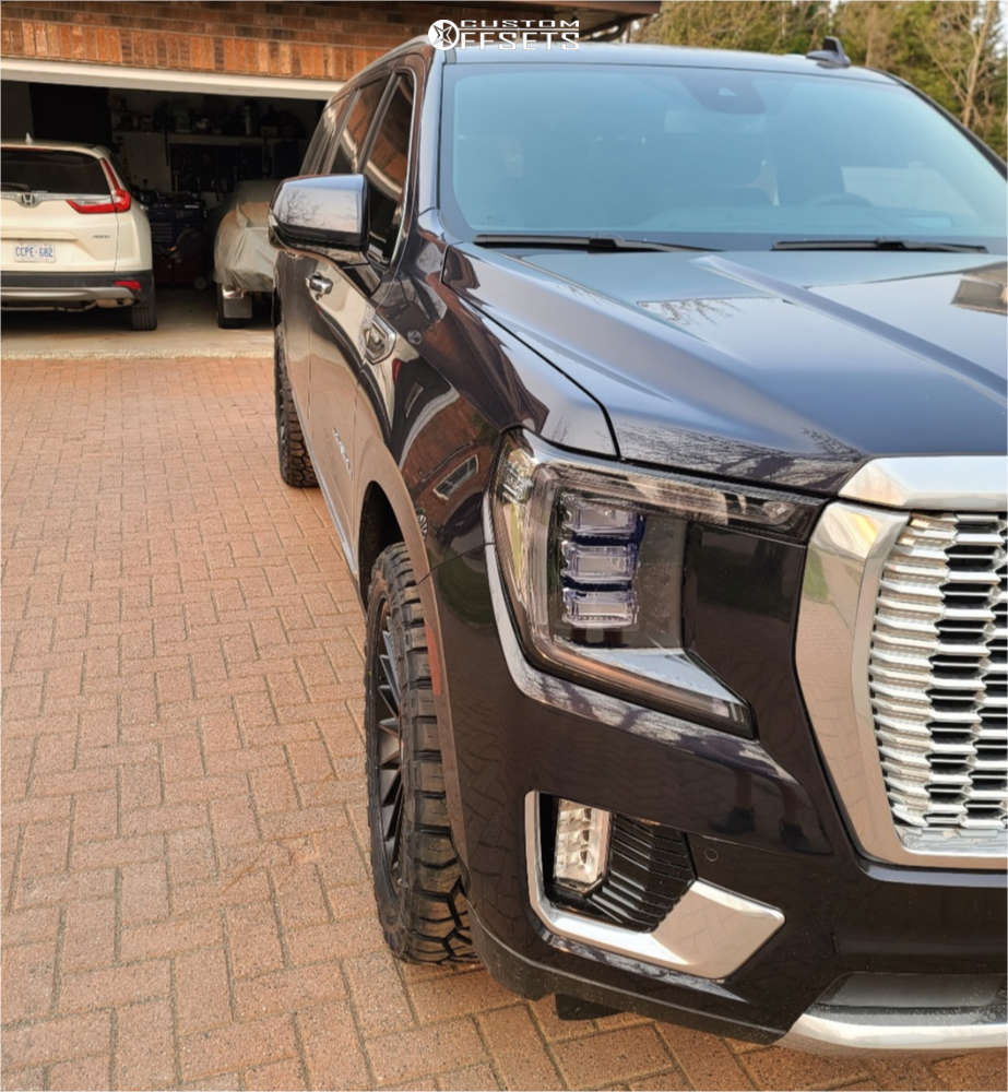 2023 GMC Yukon XL with 22x9.5 25 Status Venti and 285/50R22 Nitto Ridge ...