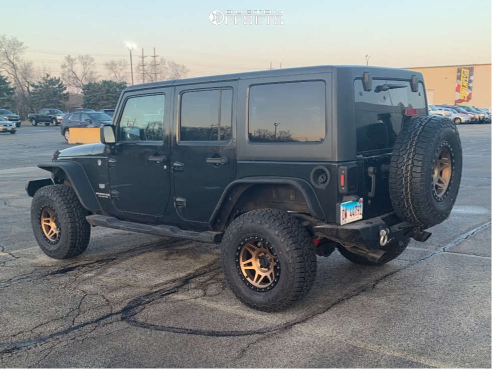 2011 Jeep Wrangler with 17x9 -12 Method Mr312 and 285/70R17 Falken ...
