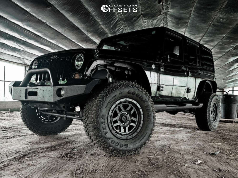 2011 Jeep Wrangler with 17x8.5 18 KMC Km540 and 315/70R17 Goodyear ...