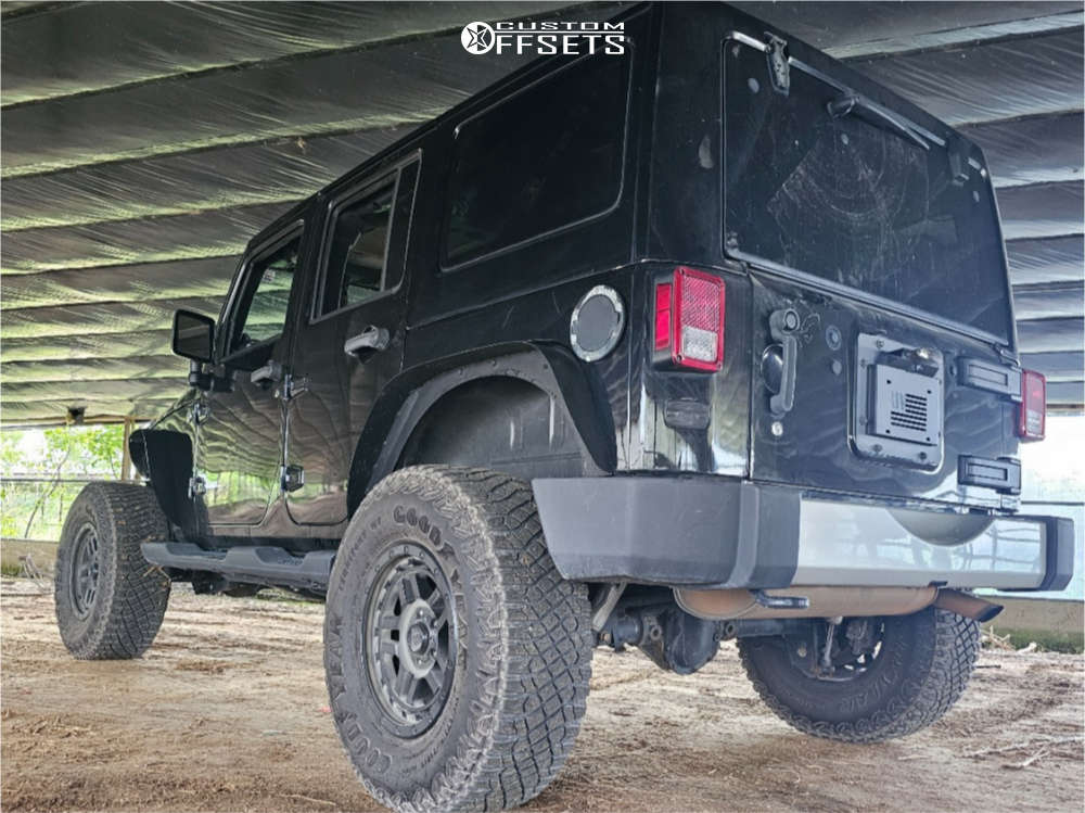 2011 Jeep Wrangler with 17x8.5 18 KMC Km540 and 315/70R17 Goodyear ...