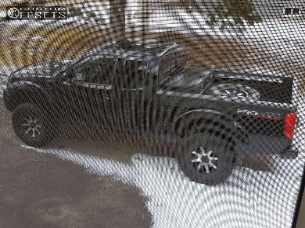 2012 Nissan Frontier with 17x8 10 Ultra Crusher and 315/70R17 Mickey ...