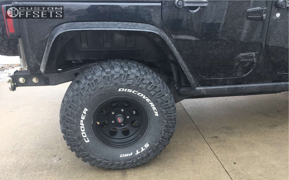 2014 Jeep Wrangler with 15x8 -19.05 Level 8 Tracker and 35/12.5R15 Cooper Discoverer Stt Pro and ...