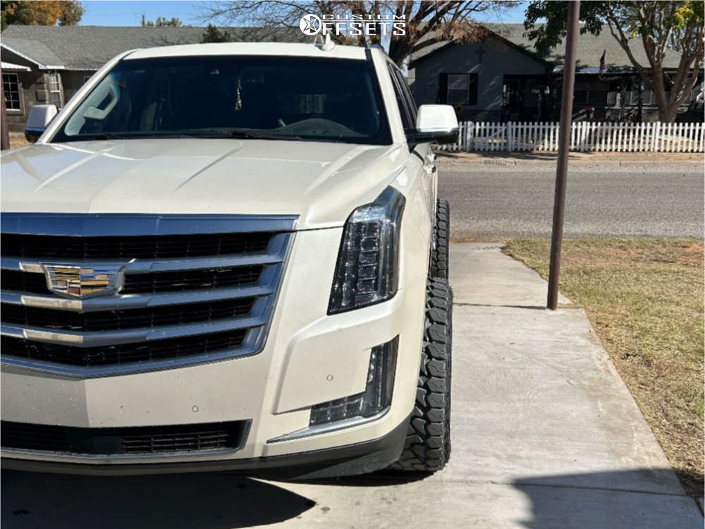 2015 Cadillac Escalade ESV with 22x12 -44 Xtreme Mudder Xm-400 and 33/ ...