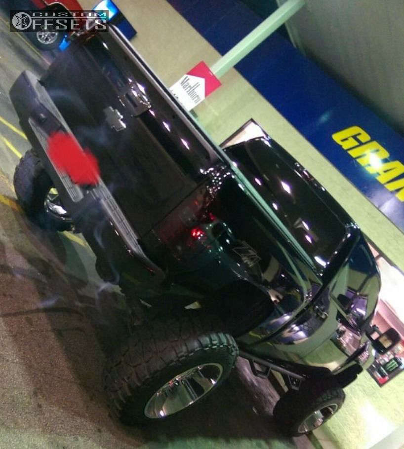 2010 Chevrolet Silverado 1500 with 22x14 -76 Hostile Exile and 37/13 ...