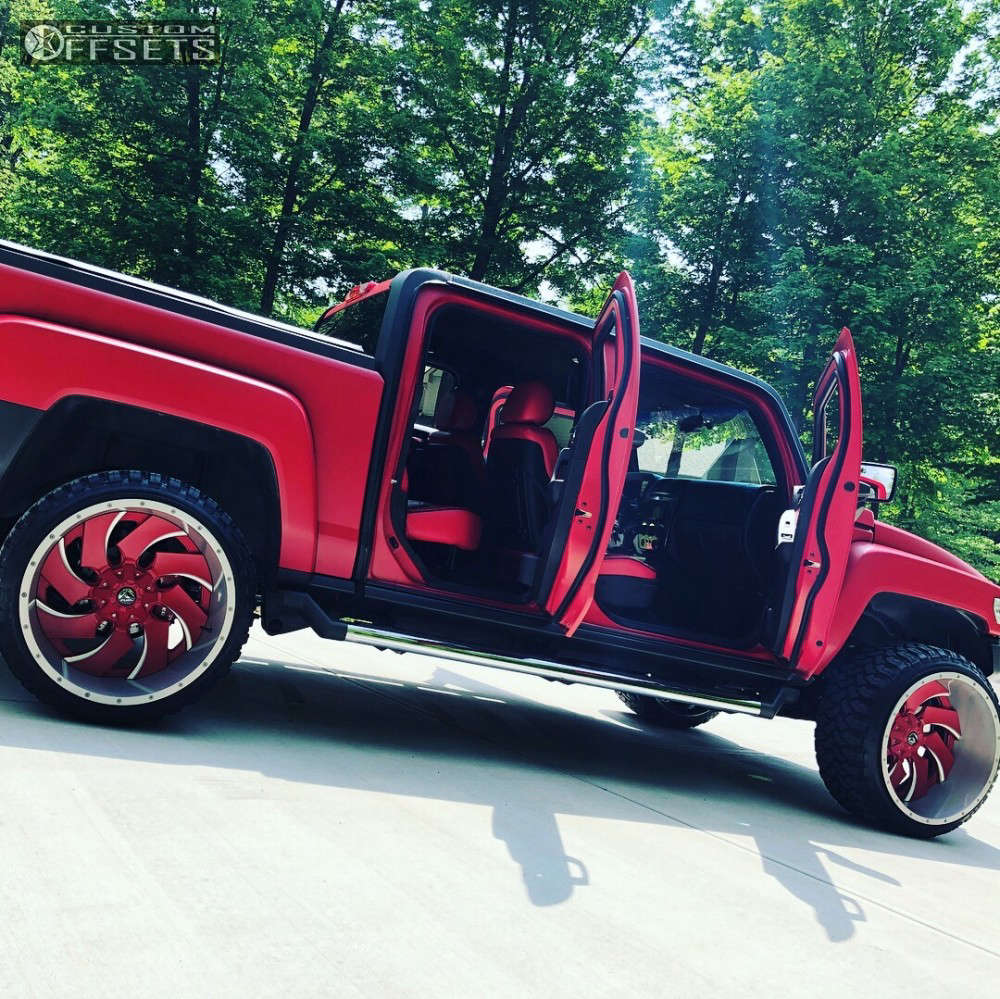 2009 HUMMER H3T with 24x14 -75 Fuel Cleaver and 33/12.5R24 Comforser ...