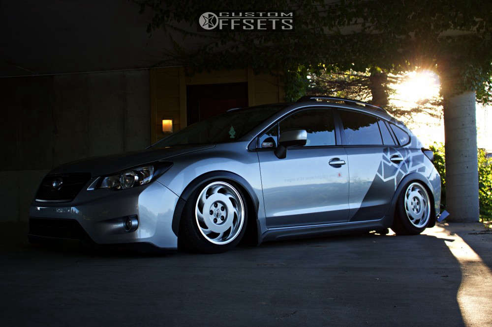 2014 Subaru XV Crosstrek with 17x9.5 31 OEM Wheels Sawblades and 215/40R17 Nitto Neo Gen and Air ...