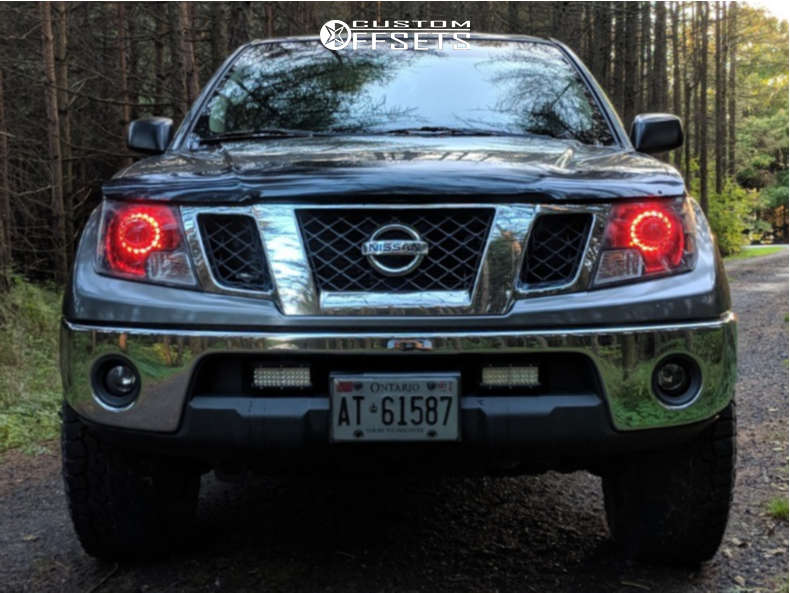 2009 Nissan Frontier with 16x8 15 Fuel Vector and 285/75R16 Falken ...
