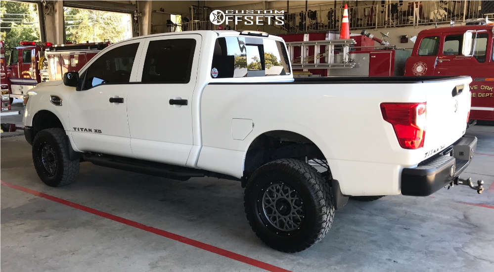 2017 Nissan Titan XD with 18x9 -12 Vision Rocker and 295/65R18 Pro Comp ...