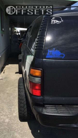 2006 Chevrolet Tahoe with 17x9 -6 Pro Comp Series 36 and 305/65R17 Pro ...