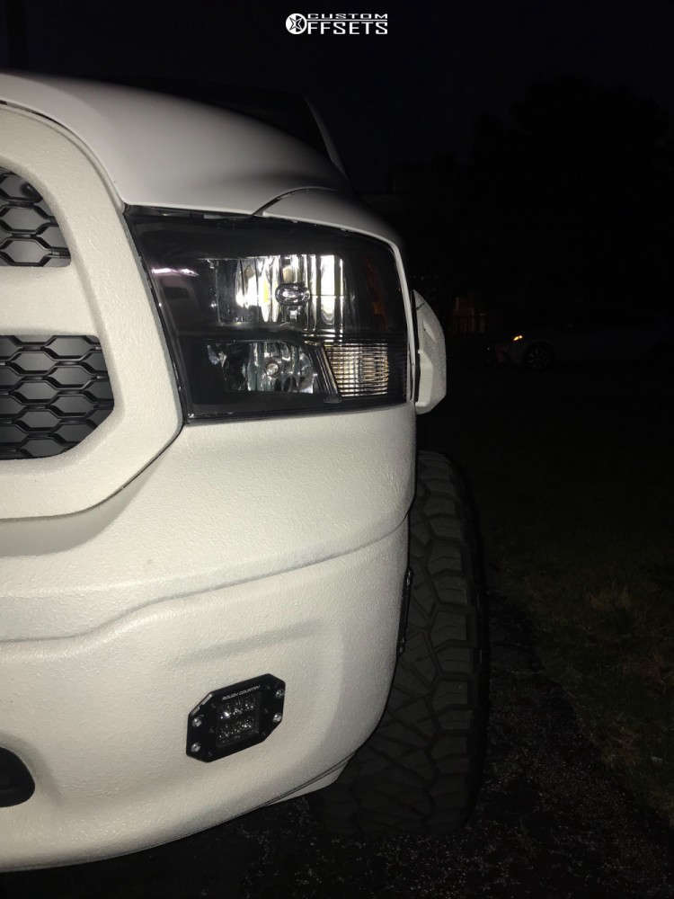 2017 Ram 1500 with 20x12 -44 Tuff T10 and 33/12.5R20 Nitto Ridge ...