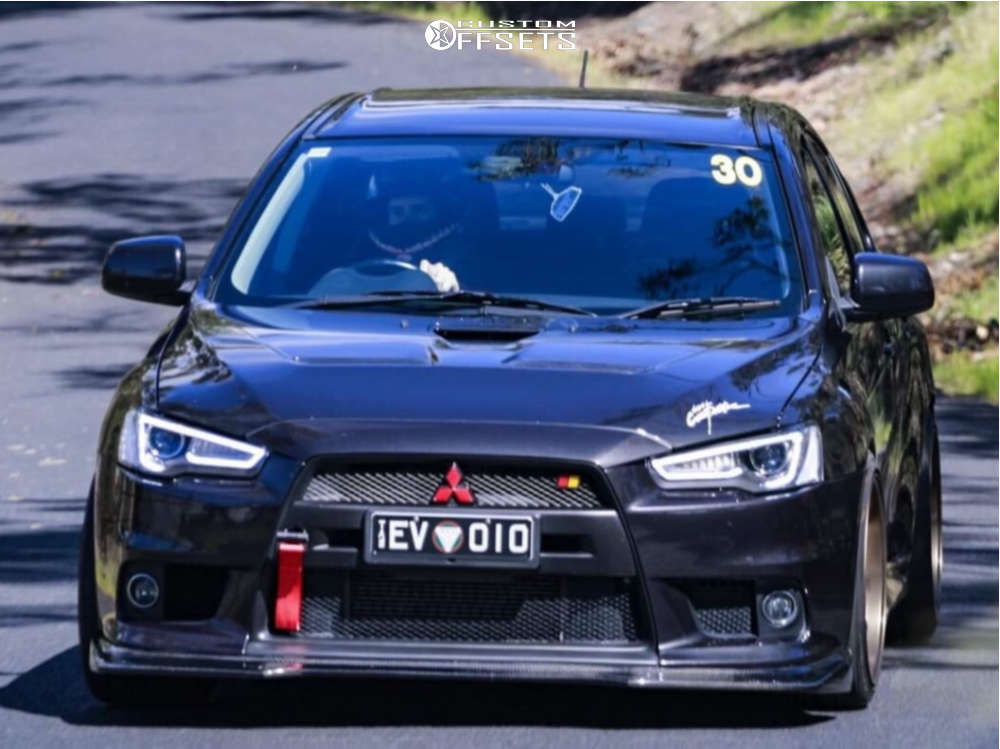 2013 Mitsubishi Lancer with 18x10.5 15 Volk Ce28n and 265/35R18 Falken ...