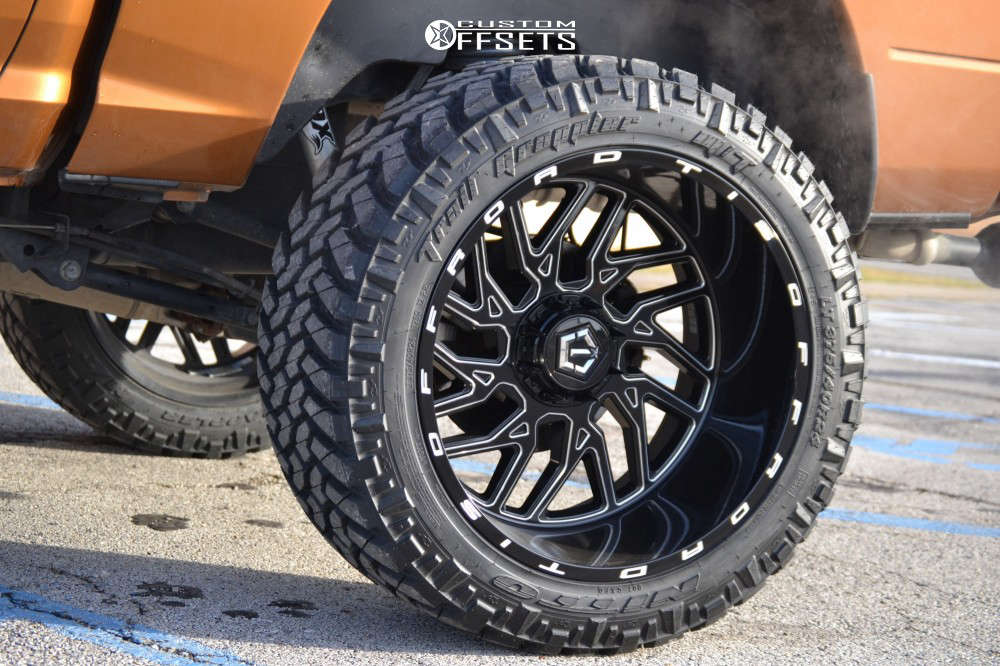 2012 Ram 1500 with 24x14 -76 TIS 544BM and 375/40R24 Nitto Trail ...