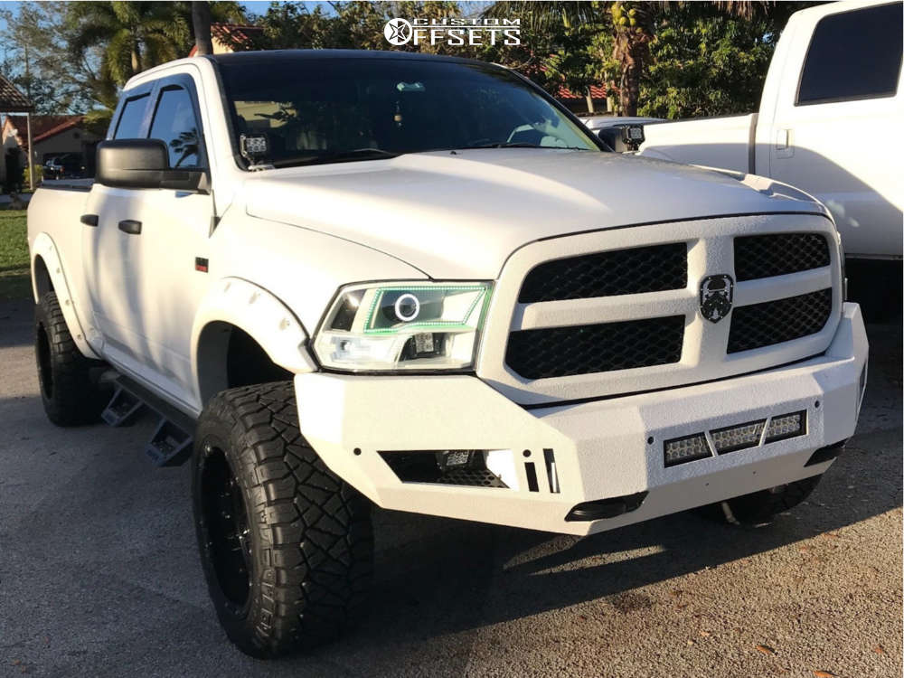 2017 Ram 1500 with 20x12 -44 Tuff T10 and 33/12.5R20 Nitto Ridge ...