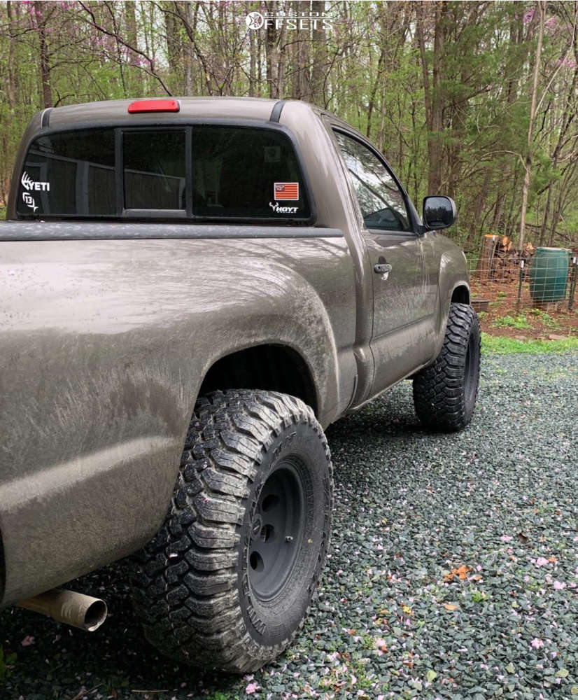 2011 Toyota Tacoma with 15x8 -18 Pro Comp Series 69 and 33/12.5R15 ...