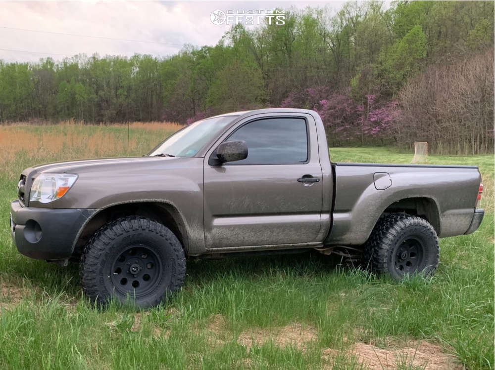 2011 Toyota Tacoma with 15x8 -18 Pro Comp Series 69 and 33/12.5R15 ...