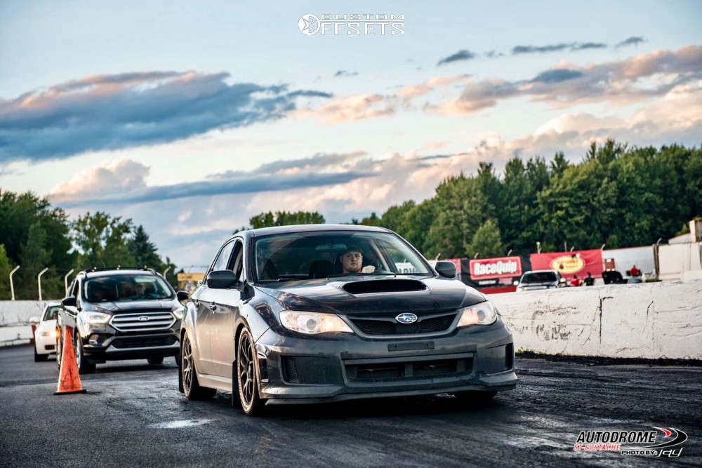 2012 Subaru WRX STI with 17x7.5 44 Enkei M52 and 245/45R17 Firestone ...