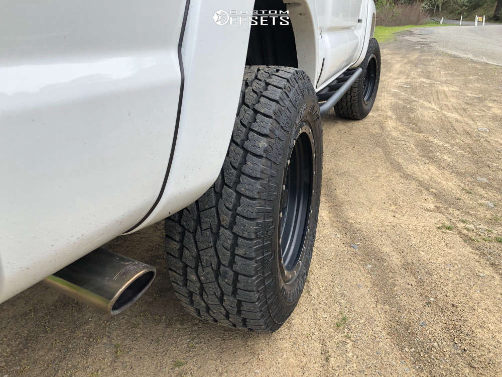2009 Toyota Tacoma with 18x9 -12 Raceline Defender and 275/65R18 Toyo ...
