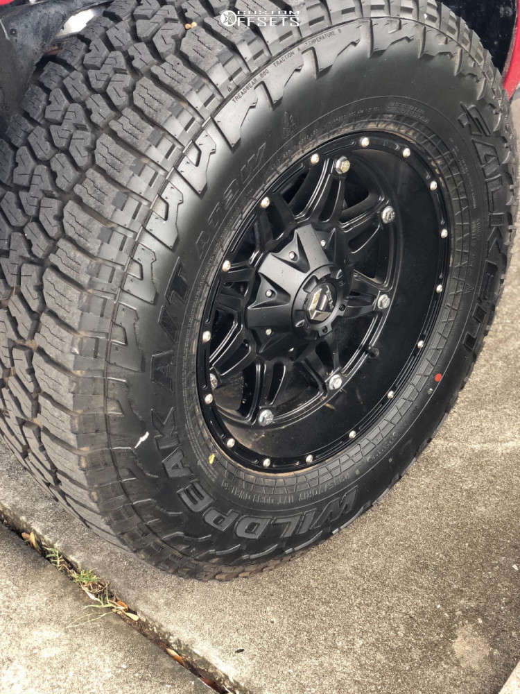 2009 Nissan Frontier with 18x9 1 Fuel Hostage D531 and 265/75R18 Falken ...