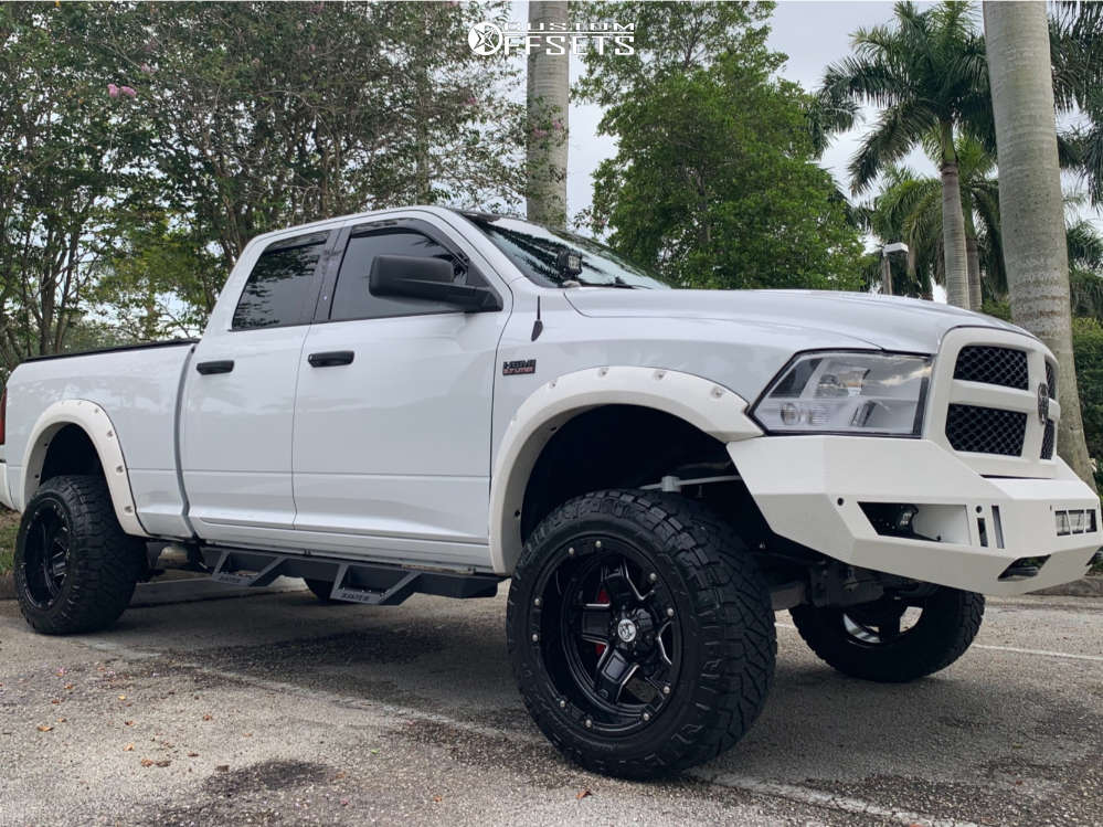 2017 Ram 1500 with 20x12 -44 Tuff T10 and 33/12.5R20 Nitto Ridge ...