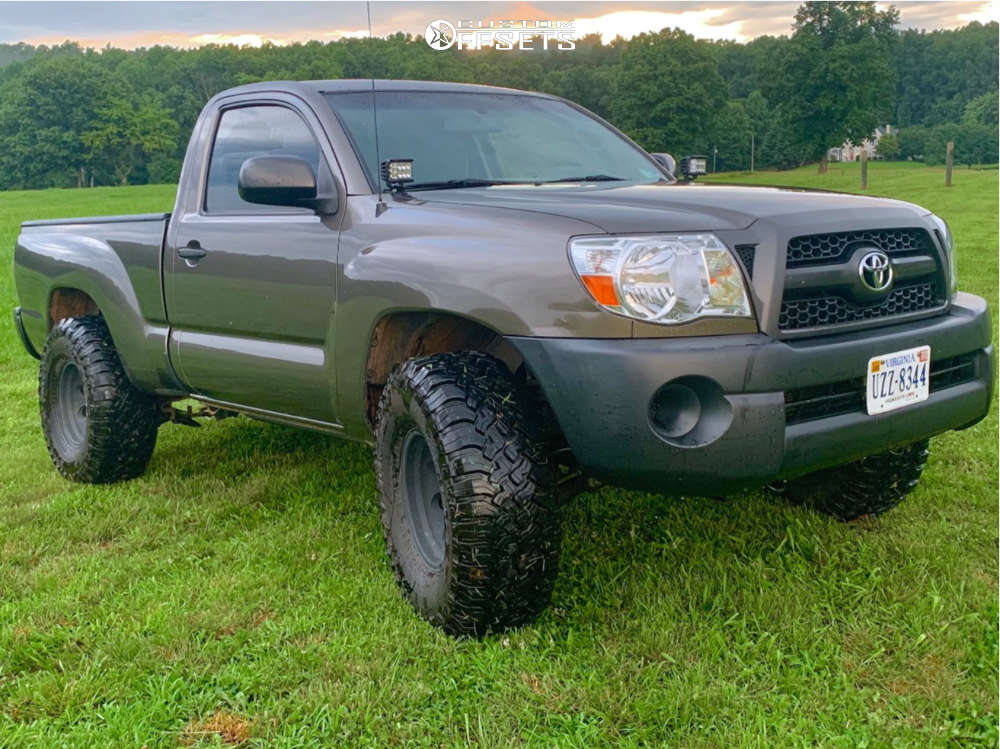 2011 Toyota Tacoma with 15x8 -12 Pro Comp 69 and 33/12.5R15 Falken ...