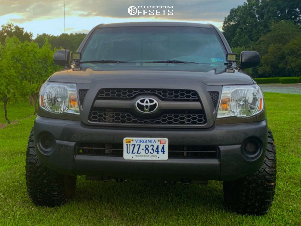 2011 Toyota Tacoma with 15x8 -12 Pro Comp 69 and 33/12.5R15 Falken ...