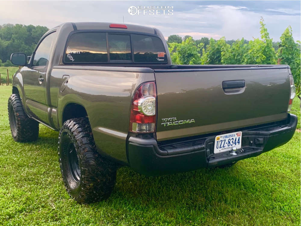 2011 Toyota Tacoma with 15x8 -12 Pro Comp 69 and 33/12.5R15 Falken ...