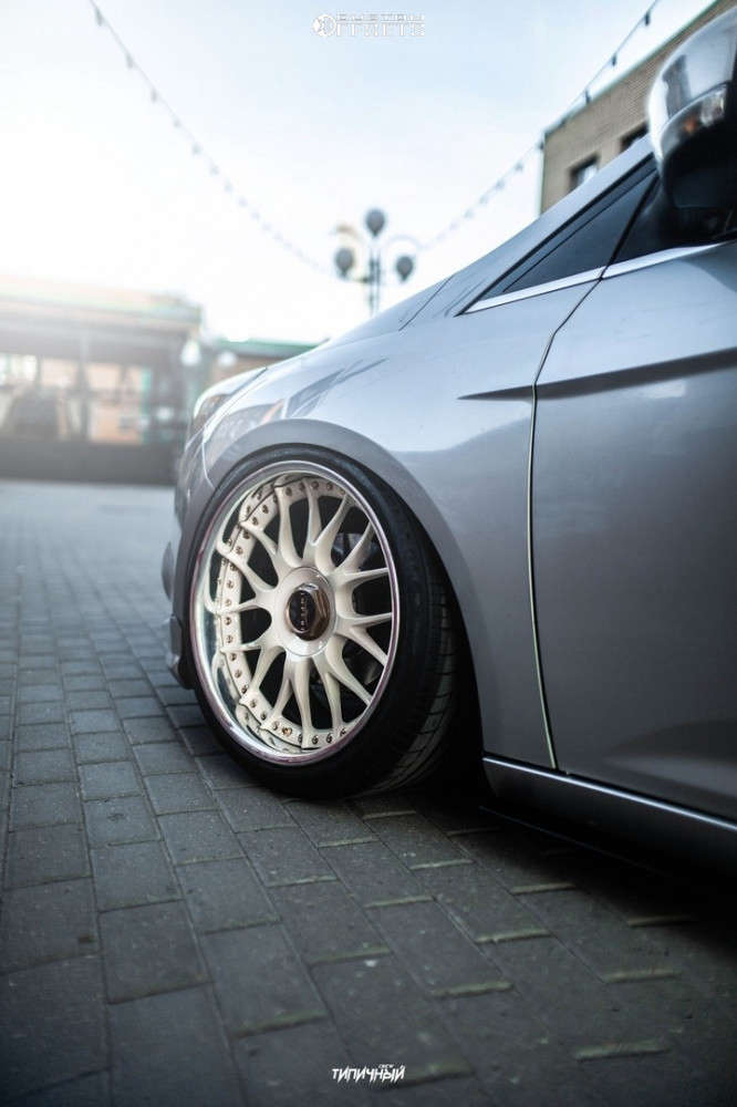 2013 Ford Focus with 18x9.5 30 Imperi and 215/40R18 Triangle and ...