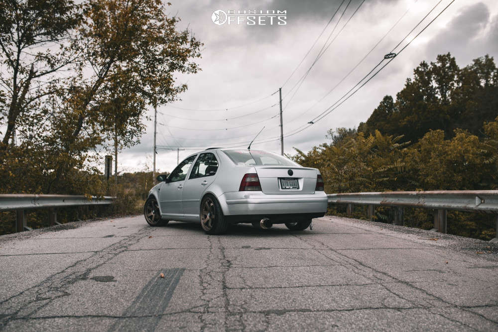 2003 Volkswagen Jetta with 18x8.5 35 AVID1 AV6 and 215/40R18 Firestone ...
