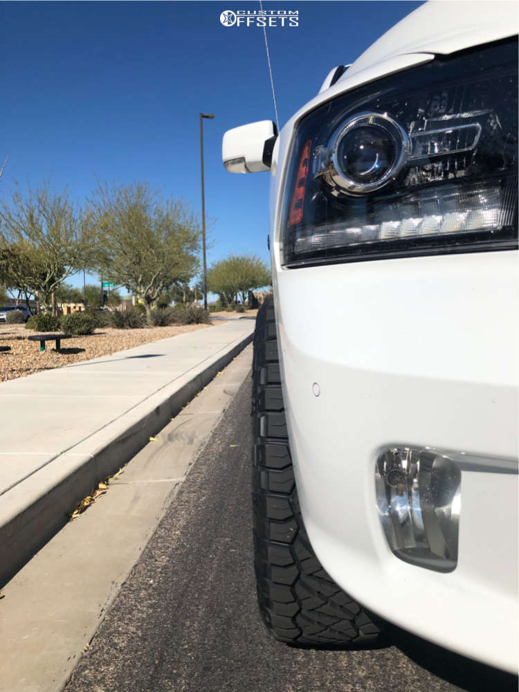 2017 Ram 1500 with 20x9.5 0 Black Rhino Attica and 275/65R20 Nitto ...